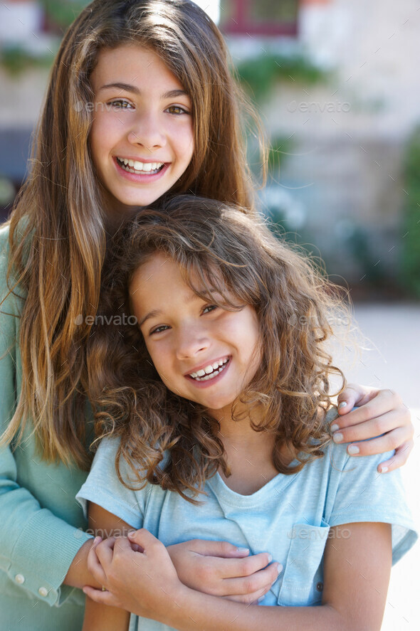 Smiling sisters hugging outdoors Stock Photo by Image-Source | PhotoDune