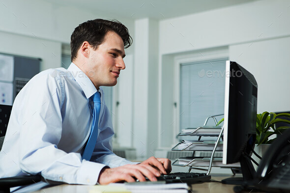 Office worker using computer Stock Photo by Image-Source | PhotoDune