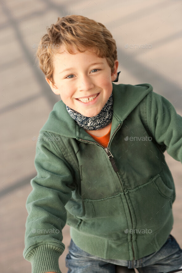 Smiling boy standing on city street Stock Photo by Image-Source | PhotoDune