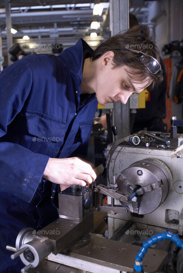 Student at work in shop class Stock Photo by Image-Source | PhotoDune