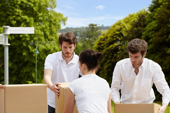 People stacking cardboard boxes Stock Photo by Image-Source | PhotoDune