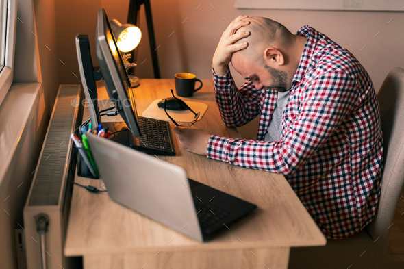 Male programmer stressed out at work Stock Photo by vladans | PhotoDune