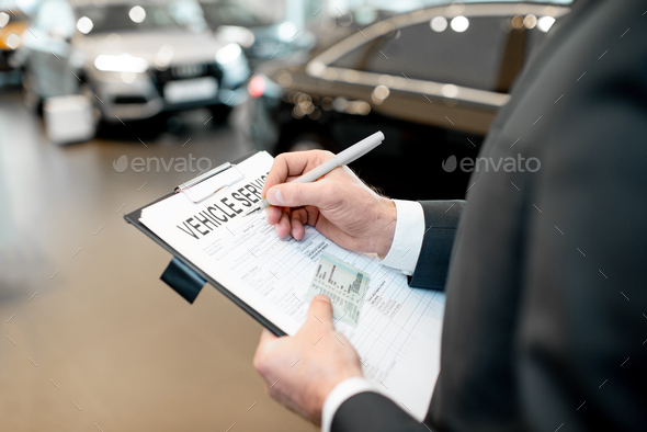 Filling vehicle service documents Stock Photo by RossHelen | PhotoDune