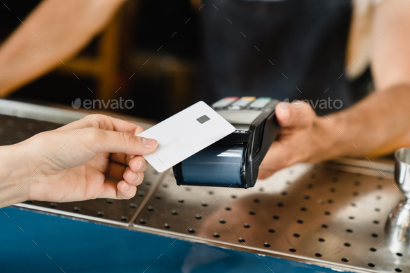 Micro ATMs while customer paying with credit card in bar restaurant ...