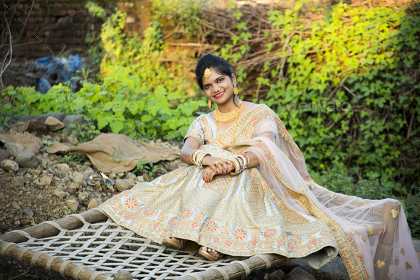Beautiful Indian bride in village Stock Photo by crshelare | PhotoDune
