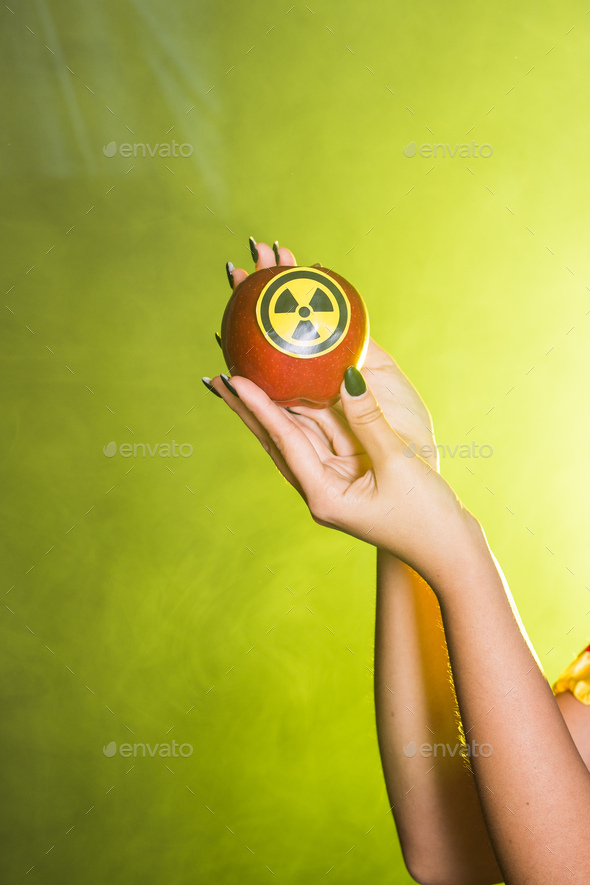 Woman dressed as fairytale character holds Radioactive atomic nuclear ...