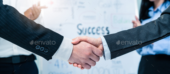 Asian businessman and woman handshake after negotiations for Business ...