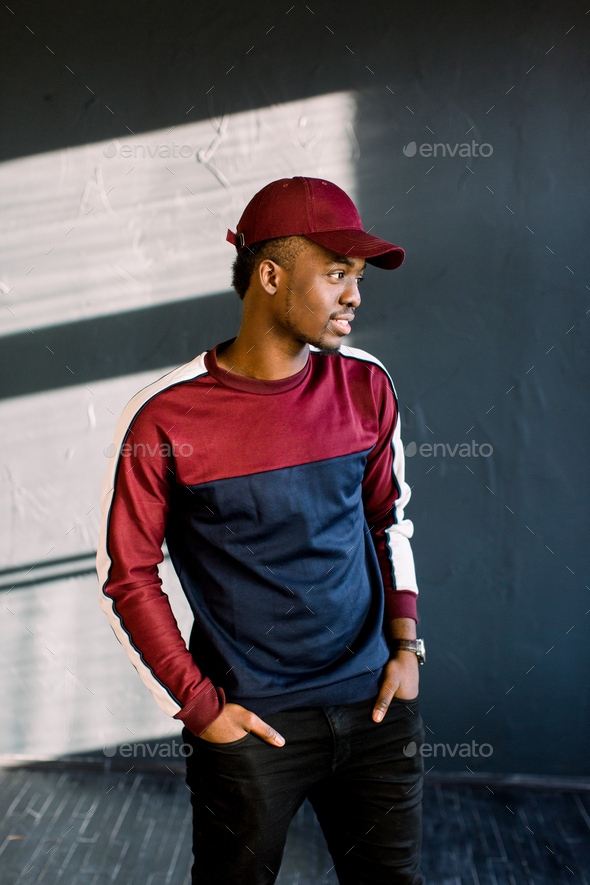 African male fashion model dressed in in red baseball cap Stock Photo ...