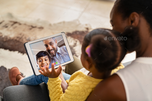 Multiethnic family doing video call using digital tablet Stock Photo by ...