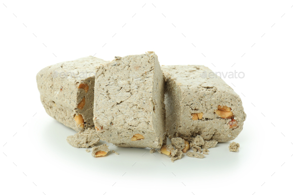 Halva with nuts isolated on white background Stock Photo by AtlasComposer
