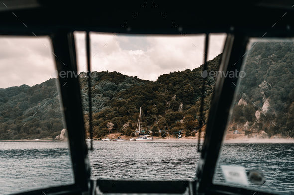 View through windows on boat near coast with forest and water Stock ...