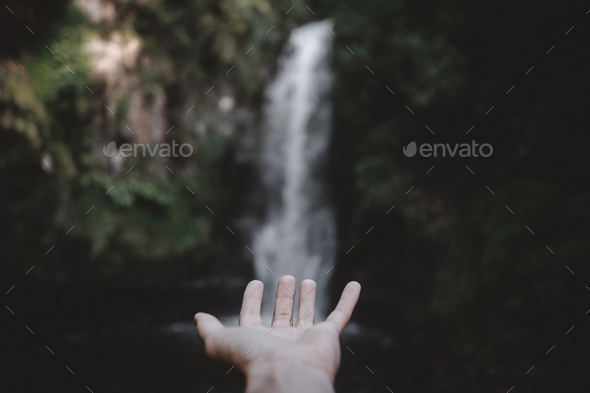 Hand showing on cascade Stock Photo by ADDICTIVE_STOCK | PhotoDune