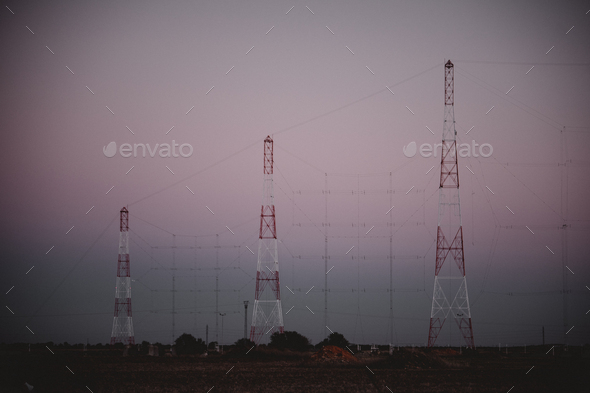 Tall electric posts in field Stock Photo by ADDICTIVE_STOCK | PhotoDune