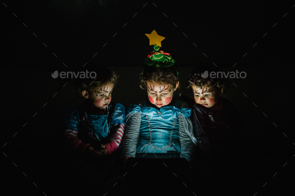three little princess girls with computer Stock Photo by ADDICTIVE_STOCK