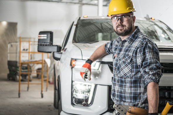Construction Contractor in Front of His Pickup Truck Stock Photo by ...