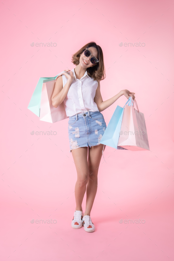 WOMAN SHOPPING PINK BACKGROUND Stock Photo by anontae2522 | PhotoDune