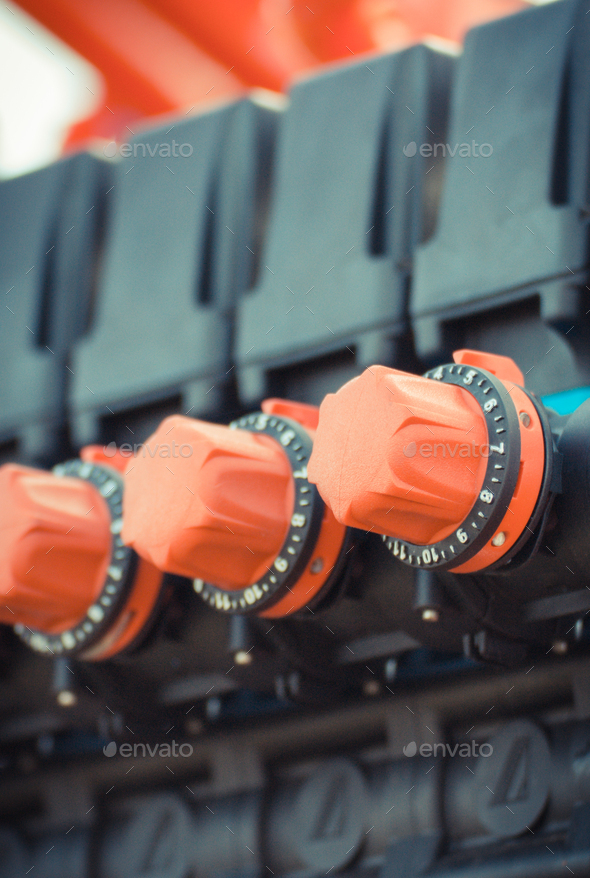 Operating control buttons or knobs in industrial machine. Technology ...