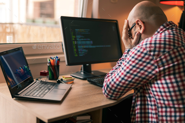 Male programmer stressed out because of code malfunction Stock Photo by ...