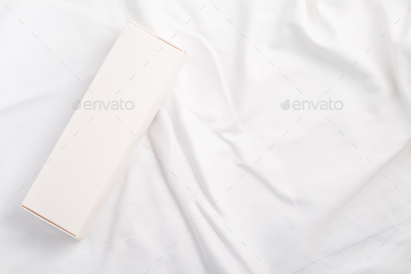 White craft box mock up on textile background Stock Photo by lyulkamazur