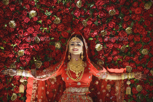 Woman wearing traditional bengali outfit Stock Photo by scopioimages