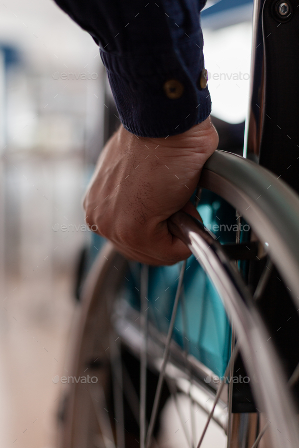 Closeup of disabled paralyzed businessman hands in wheelchair Stock ...