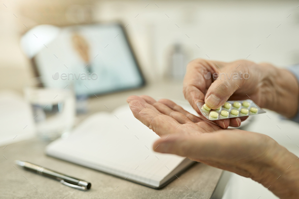 Elderly person taking medication per doctor prescription Stock Photo by ...