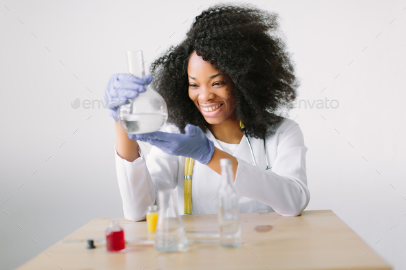 Portrait of a young beautiful African American girl researcher ...