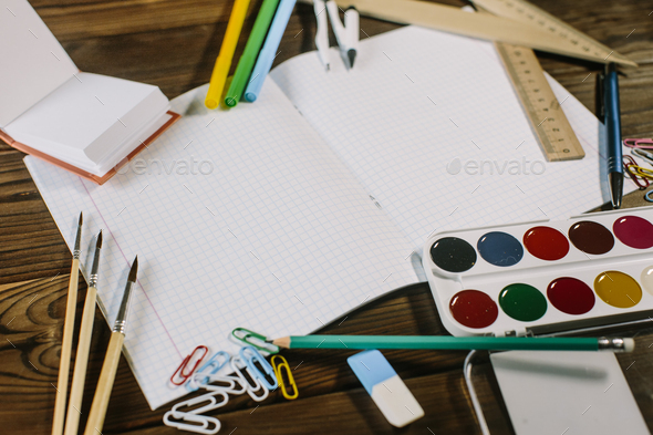 School supplies on a wooden desk . Realistic illustration. Stock Photo ...