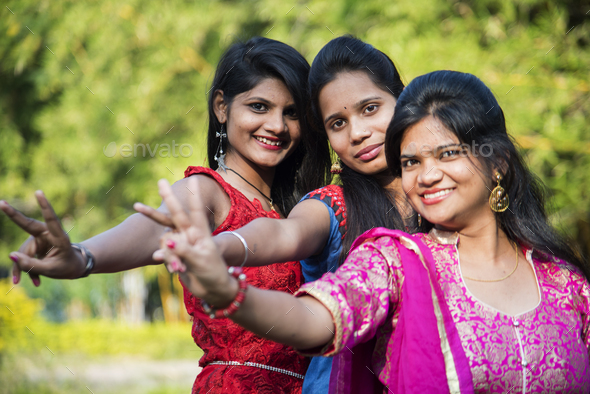 Happy Indian young girls smiling and having fun at outdoor. Stock Photo ...