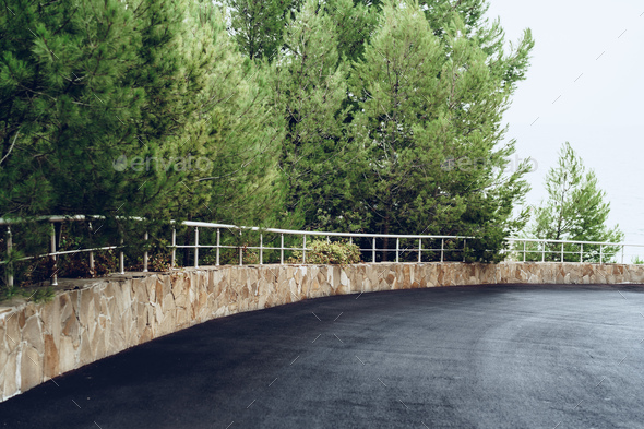 Picturesque concrete slope walkway with plants on the sides Stock Photo ...