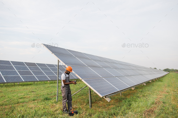 Engineer measuring amperage in solar panels outdoors Stock Photo by ...