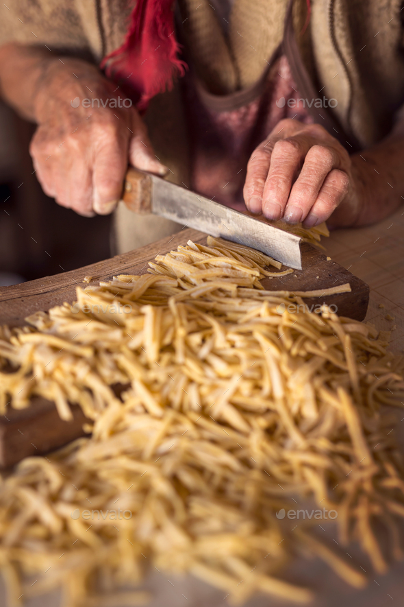 Cutting pasta Stock Photo by Impactphotography | PhotoDune