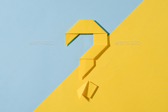 Yellow origami question mark on a diagonal two tone background Stock ...