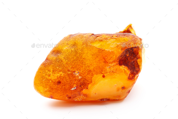 Natural amber. A piece of yellow opaque natural amber on white ...