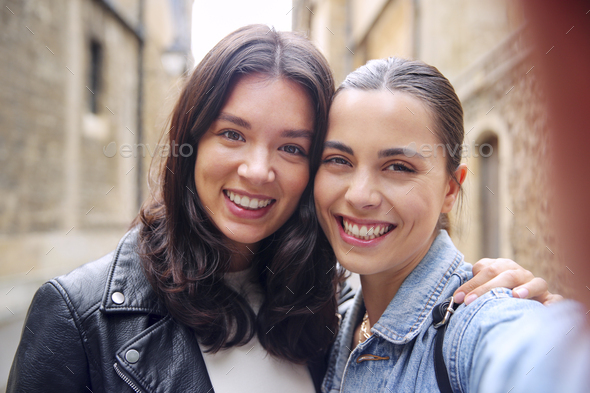 POV Shot Of Same Sex Female Couple Pose For Selfie As They Visit Oxford ...