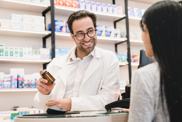 Pharmacy consultation. Druggist advising painkillers, antibiotics ...