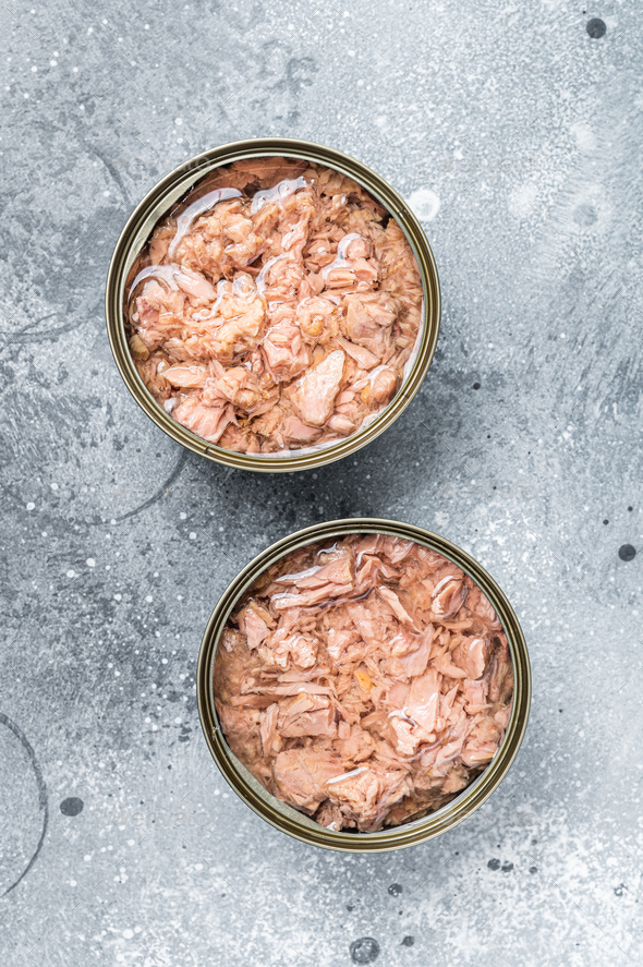 Open tin can with canned tuna fish. Gray background. top view Stock ...