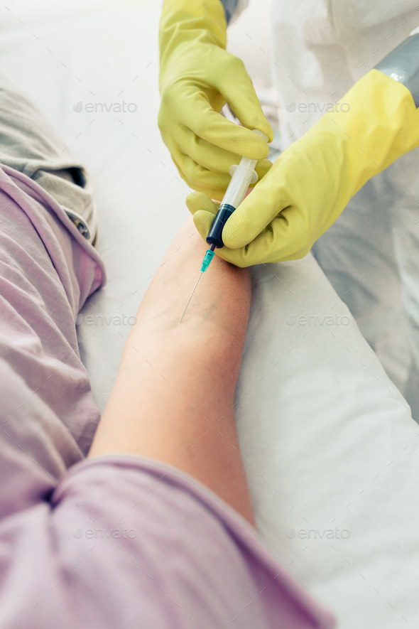 Doctor doing blood test to patient lying on the gurney Stock Photo by ...