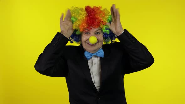 Senior Old Woman Clown in Colorful Wig Smiling, Making Silly Faces, Fool Around, Stock Footage