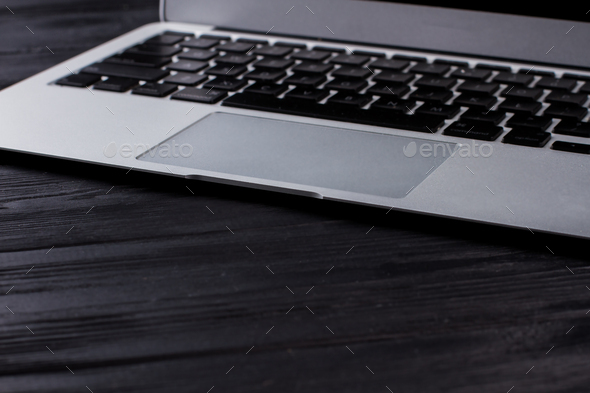 Close up laptop touchpad and keyboard. Stock Photo by stockfilmstudio