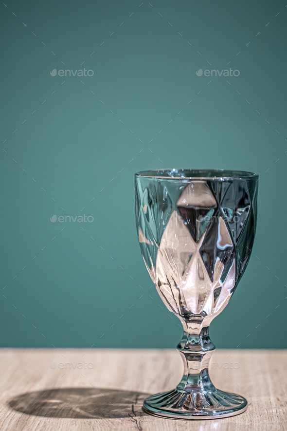 Shiny textured glass on a light blue background. Stock Photo by puhimec