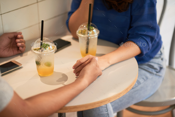 Holding Hands On Table Stock Photo by DragonImages | PhotoDune
