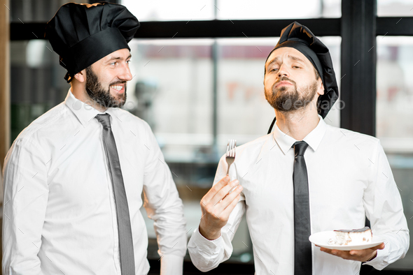Chefs with cake in the office Stock Photo by RossHelen | PhotoDune
