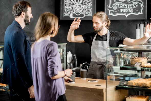 People buying coffee in the coffee shop Stock Photo by RossHelen ...