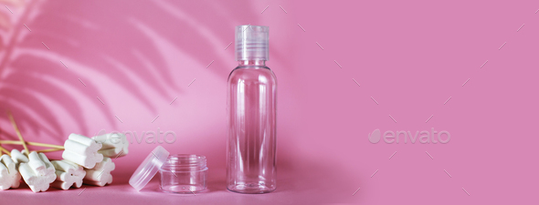 spa cosmetic products with sweet, transparent empty tube on pink ...
