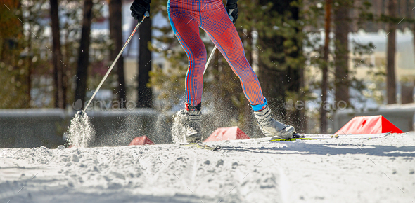 legs skier athlete in splashes snow on track Stock Photo by ...