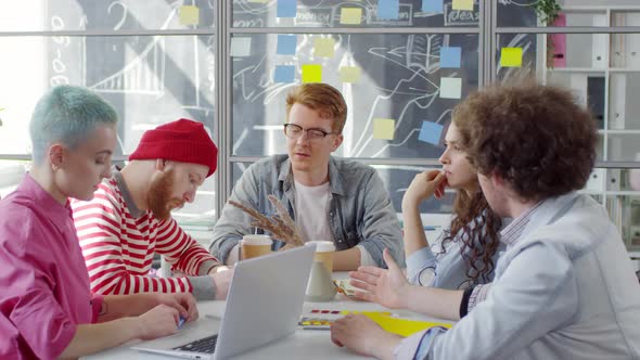 Creative Team Members Proposing Ideas at Meeting, Stock Footage | VideoHive