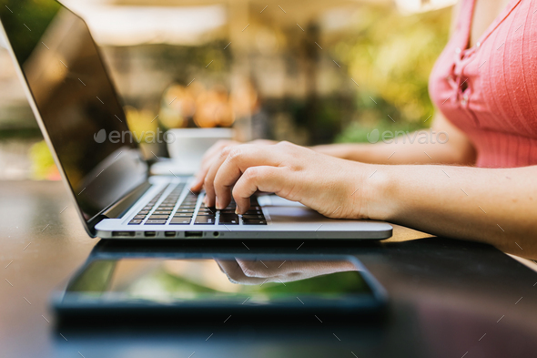 Side view woman hands working on laptop Stock Photo by xapdemolle