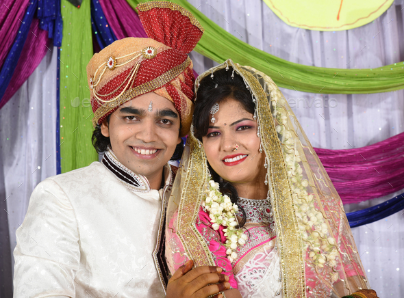 Traditional Indian bride and groom in marriage ceremony Stock Photo by ...