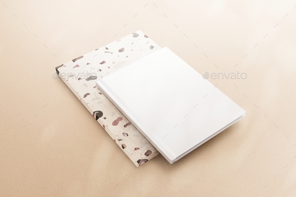 Blank white book cover on beige background Stock Photo by Rawpixel